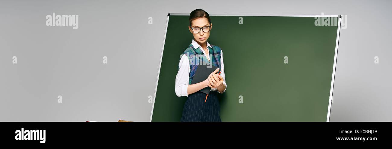 Beautiful female student in uniform in front Stock Photo - Alamy