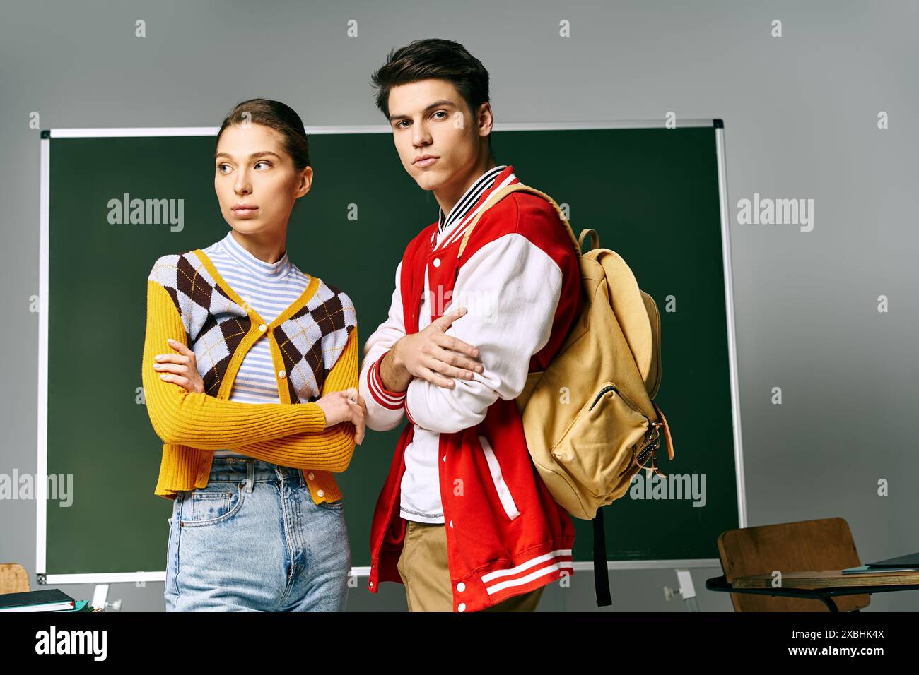 Two young students in casual attire standing confidently in front of a ...