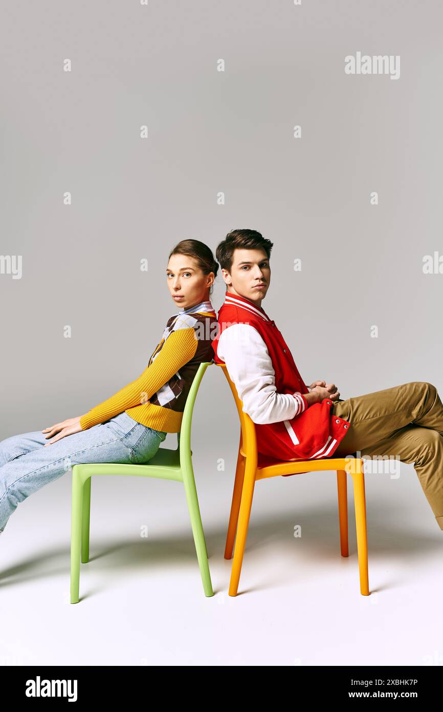 Stylish students lounge on a colorful chair in a college classroom ...