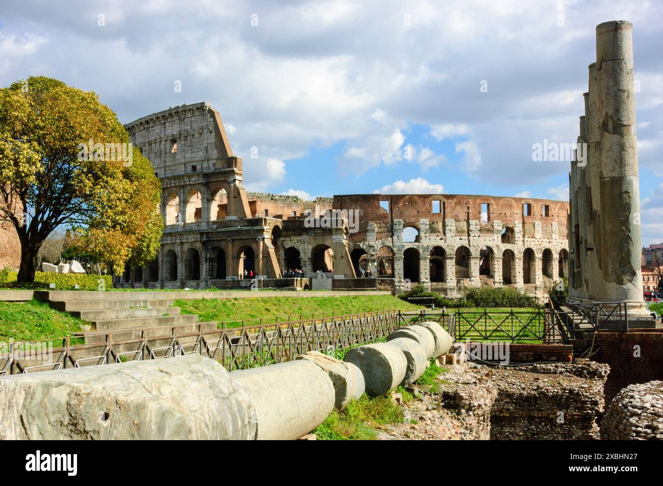 View of the colleseum with fallen marble columns as lead in lines of ...