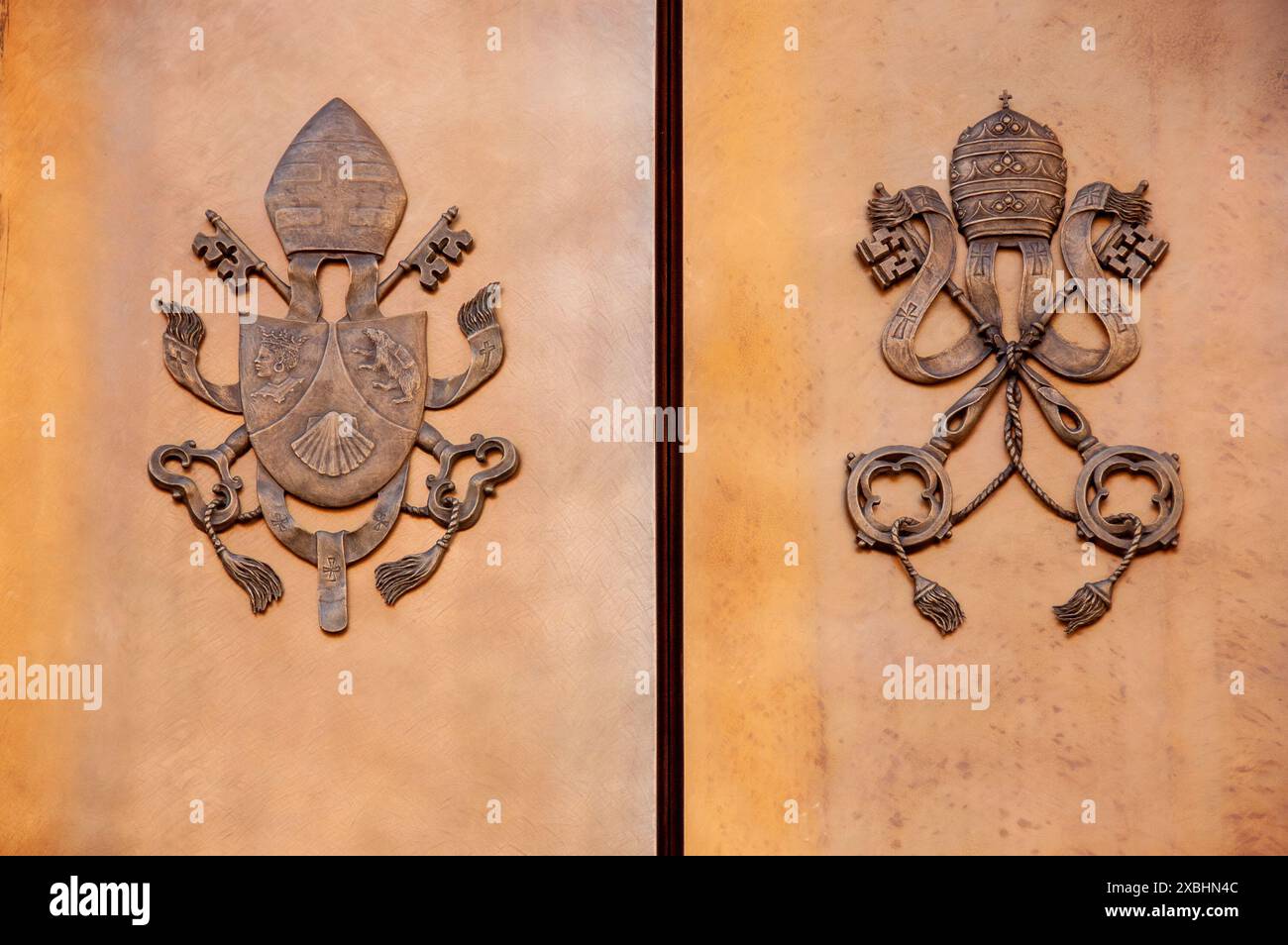 Ornate Papal crest detail on bronze gilt doors in the Vatican City near ...