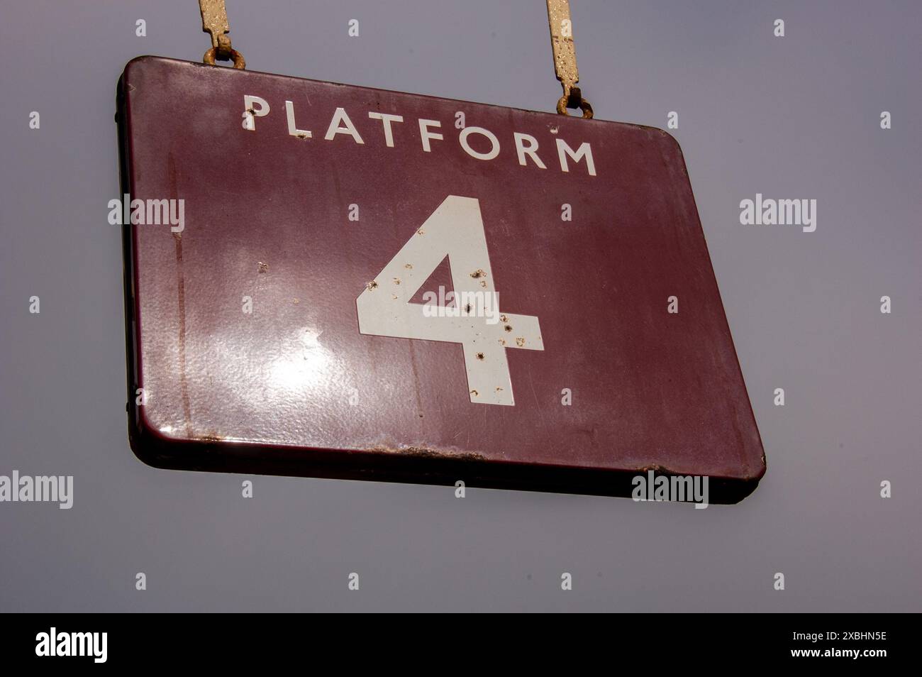 The train now departing from Platform 4. Vintage platform sign fromt he ...
