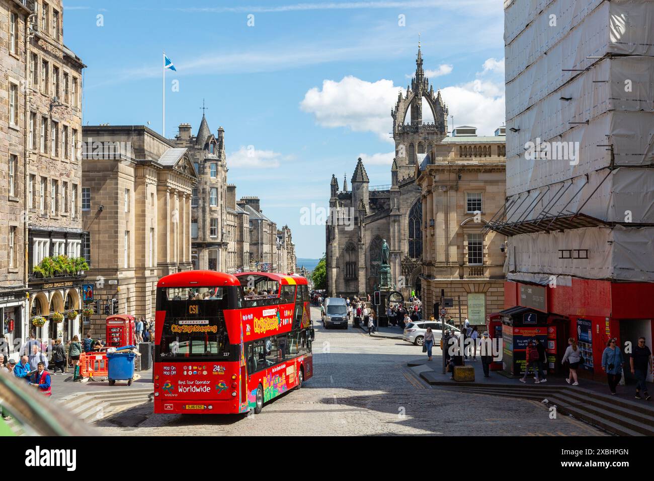 An open top bus touring Edinburgh's Royal Mile on a summers day Stock ...