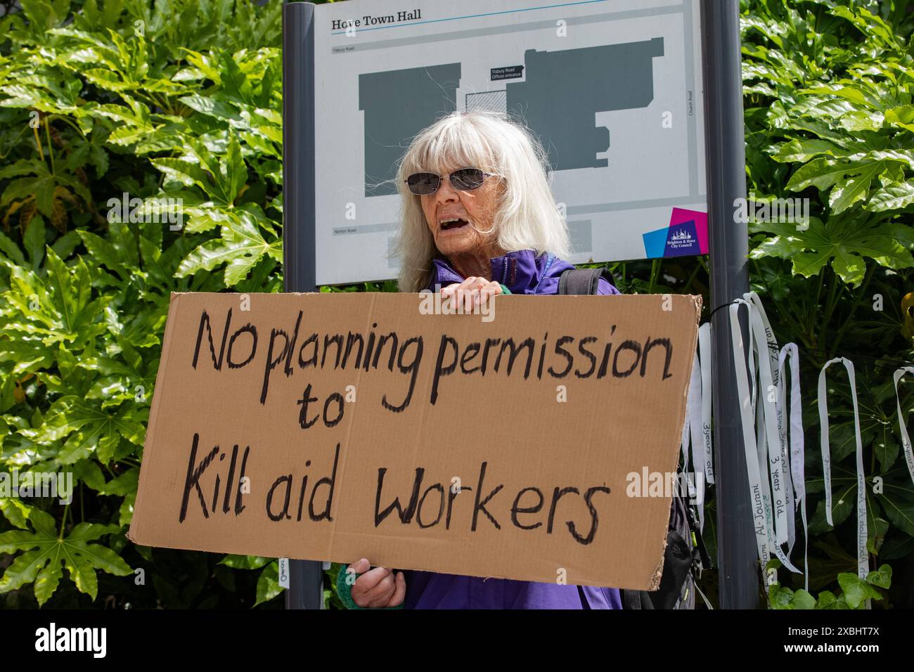 Brighton, UK. 5th June, 2024. A Stop L3Harris campaigner protests ...