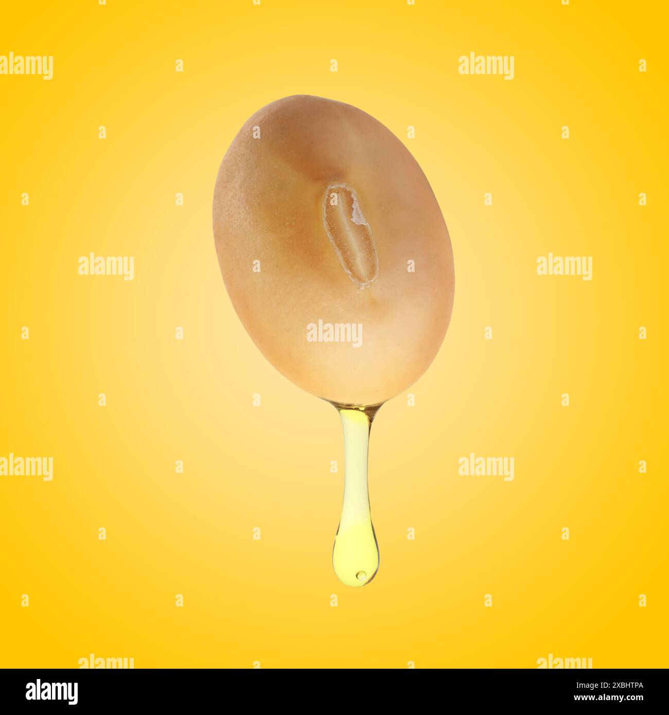 Cooking oil dripping from soybean on yellow background Stock Photo - Alamy