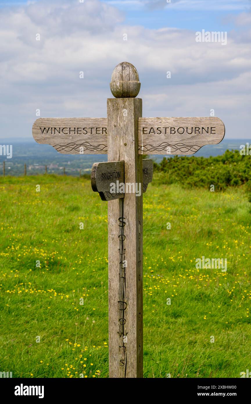 Wooden signpost giving directions to Winchester, Eastbourne and ...