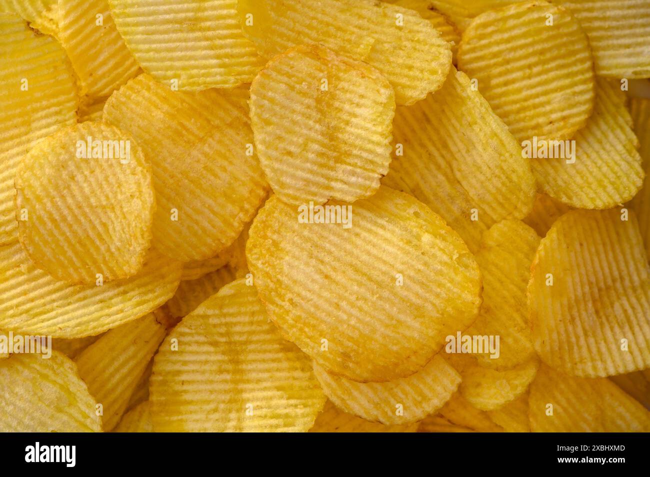 crispy potato chips snack texture background top view 1 Stock Photo - Alamy