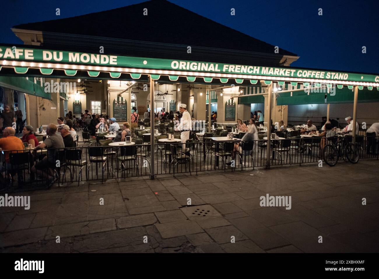 A lively night at Cafe Du Monde, a historic New Orleans landmark known ...