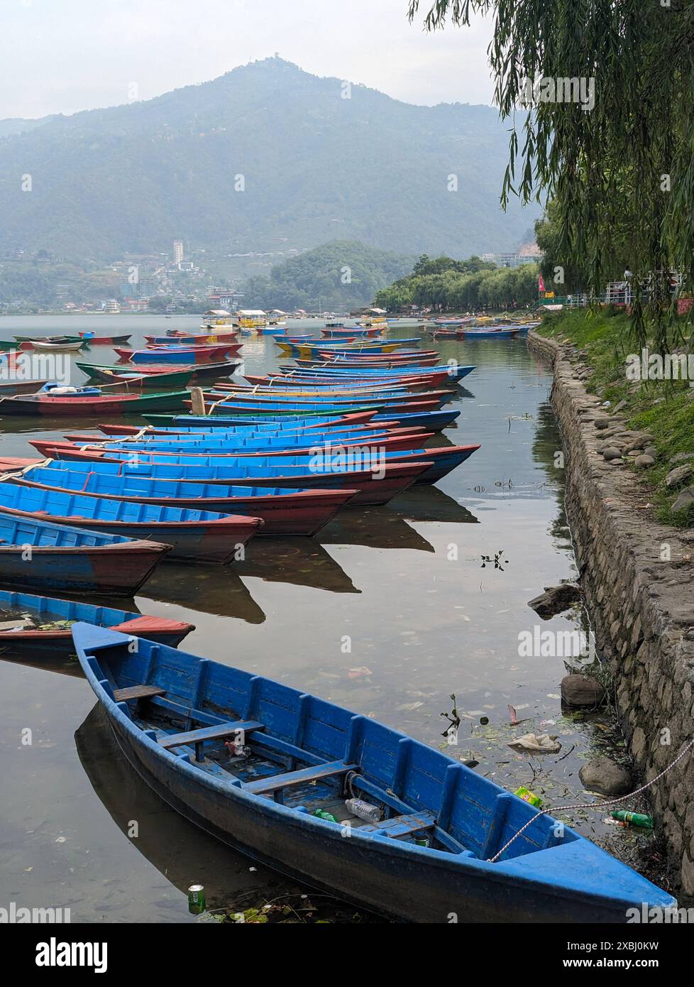Lake Phewa with colourful boats, Pokhara, Nepal Stock Photo - Alamy