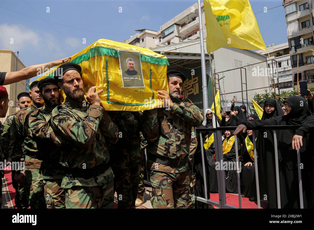 Beirut, Lebanon. 12th June, 2024. Pro-Iranian Hezbollah militants carry ...