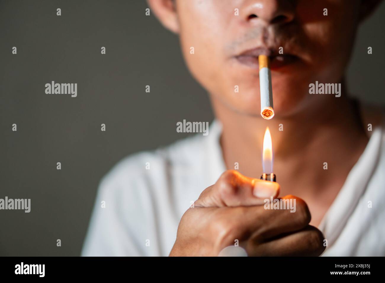 Lighting cigarette with a candle hi-res stock photography and images ...