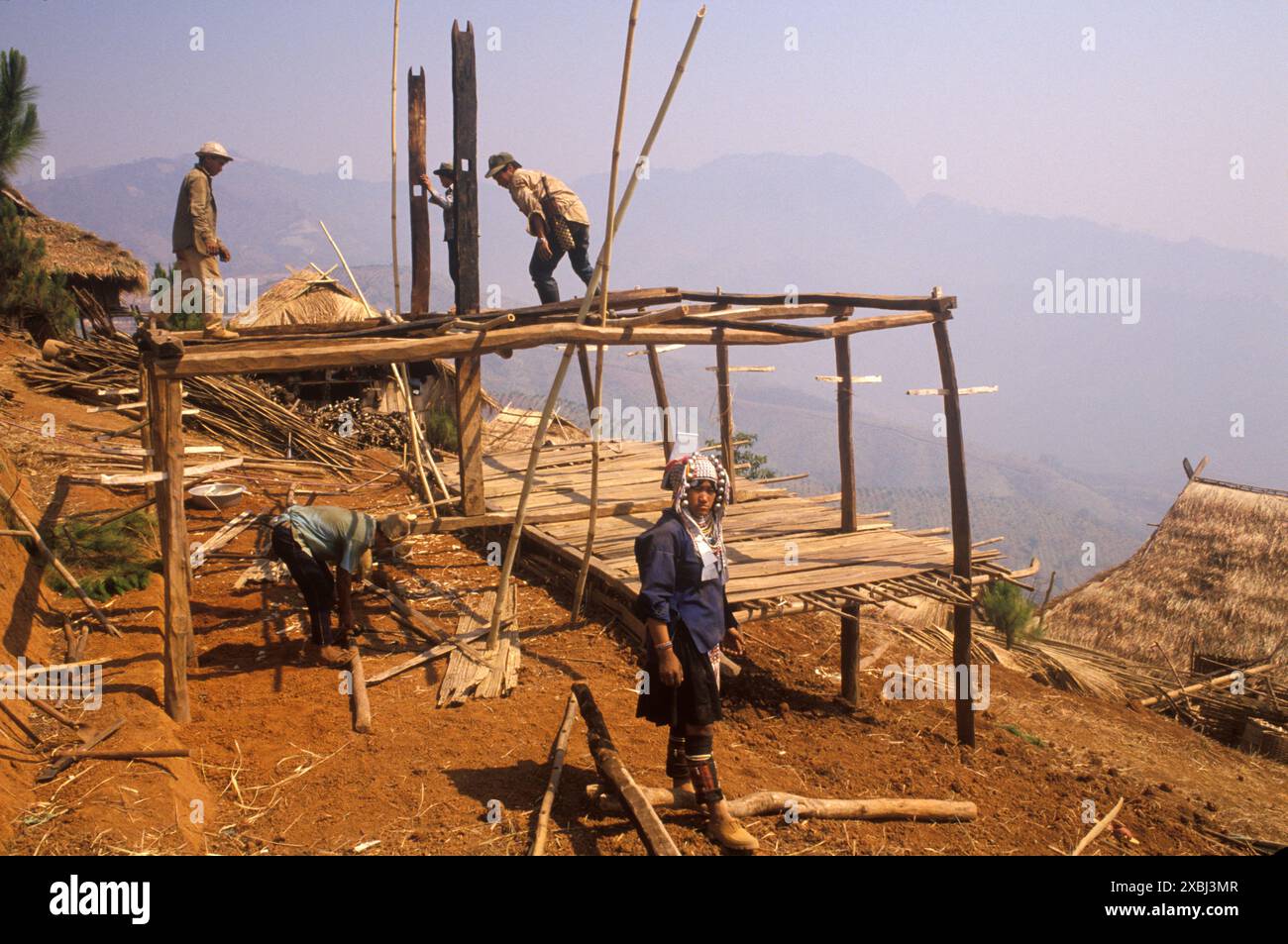 Akha village in the mountains of Northern Thailand 1995. Villagers ...