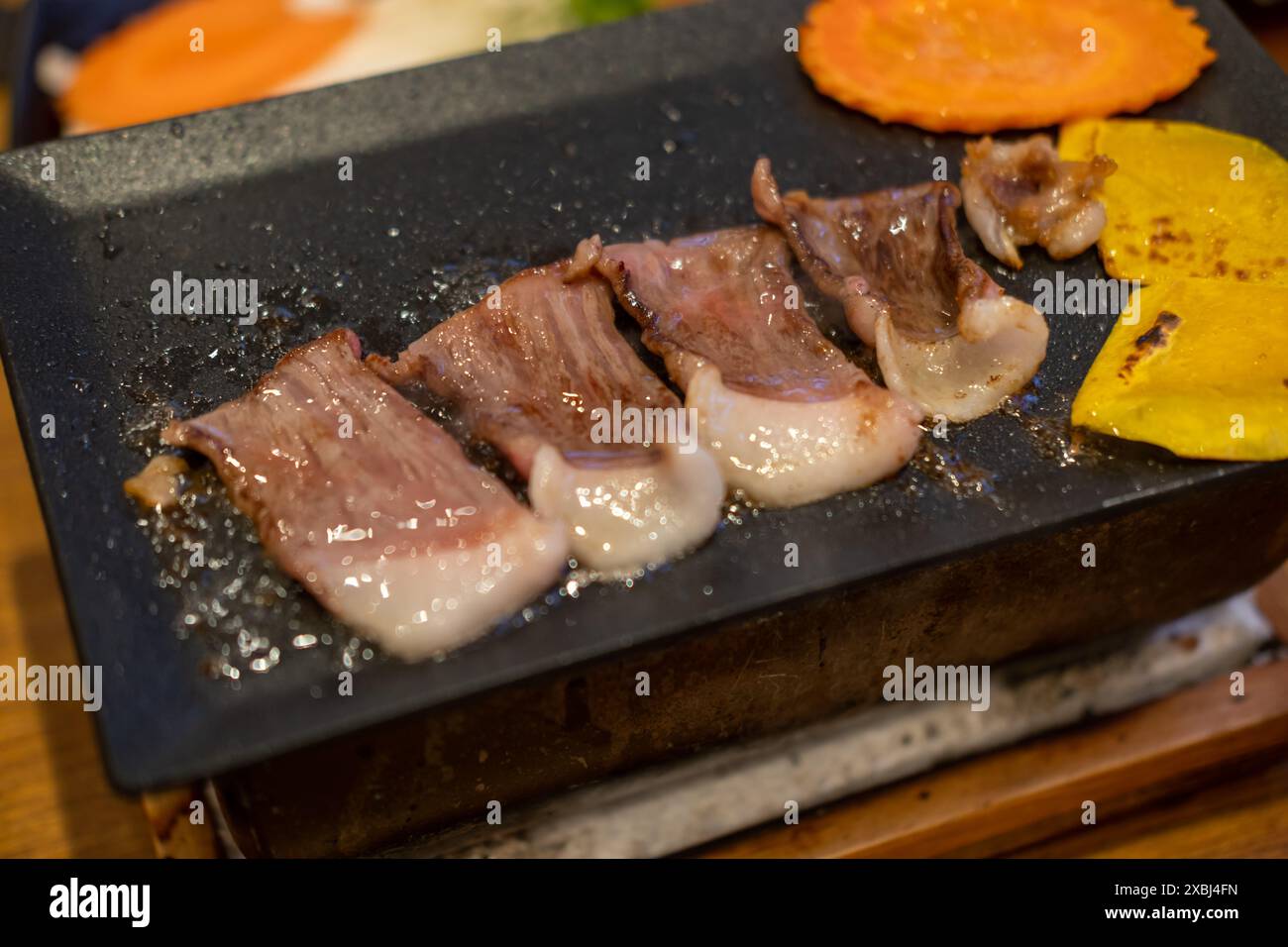 Akita Wagyu beef sliced on the grill Stock Photo - Alamy