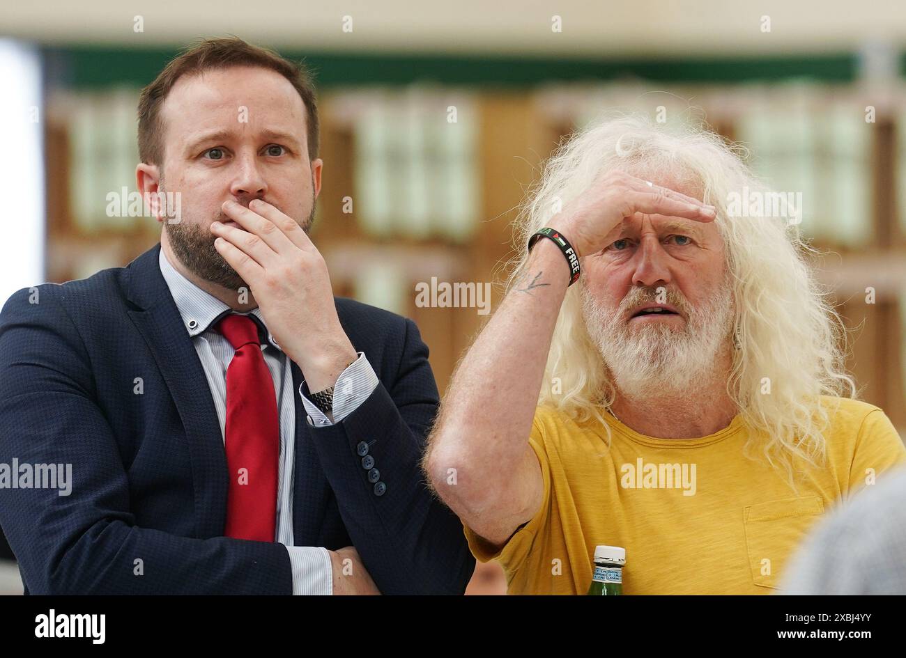 Mick Wallace (right) in the count centre as counting continues at Nemo ...