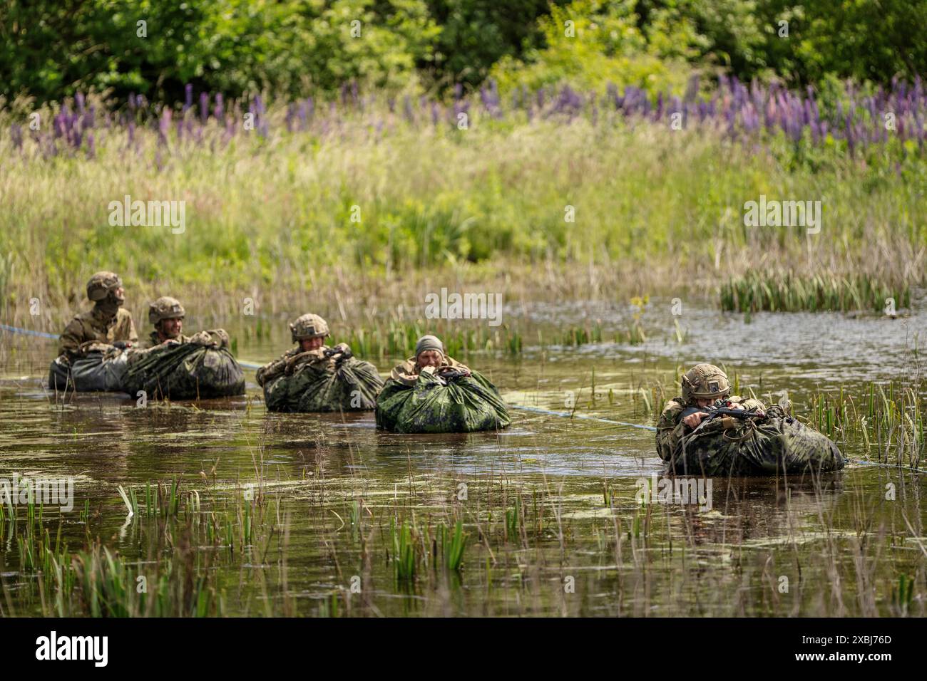 Conscripts from The Royal Life Guards during water passage on REX-tour ...