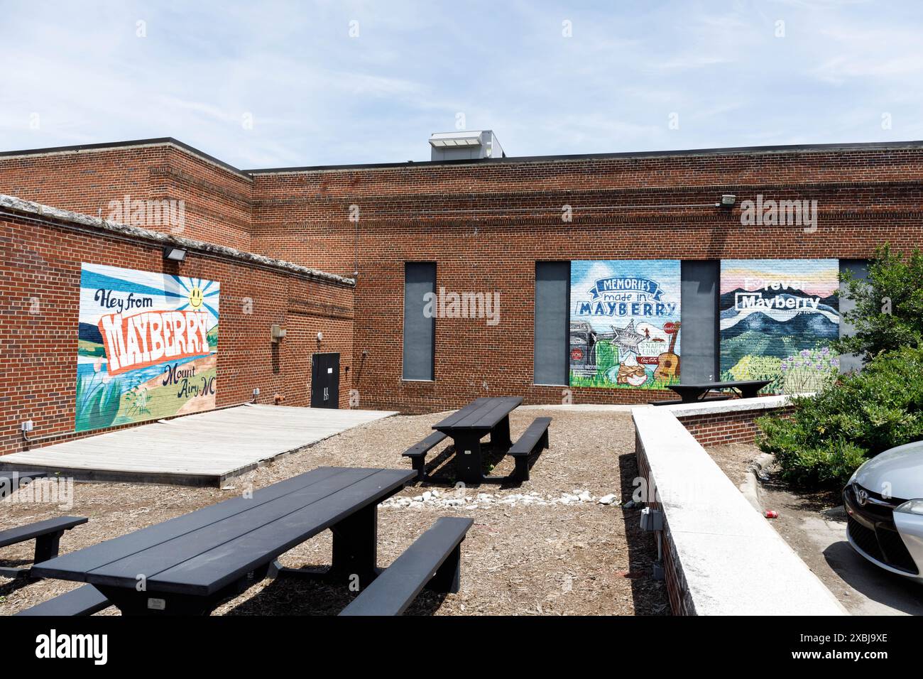 Mt. Airy, NC, USA-June 1, 2024: Three hand-painted murals documenting ...