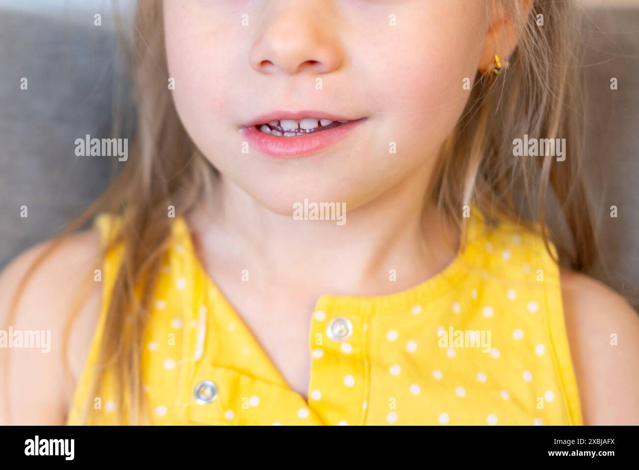 closeup girl's radiant smile radiates pure joy and innocence, evoking ...