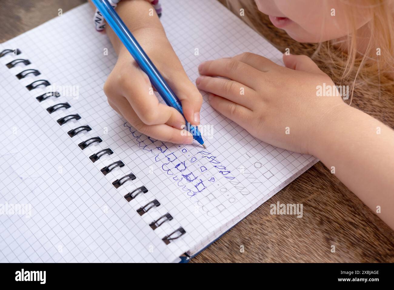 Writing Before School, preschool girl draws elements with pen in ...