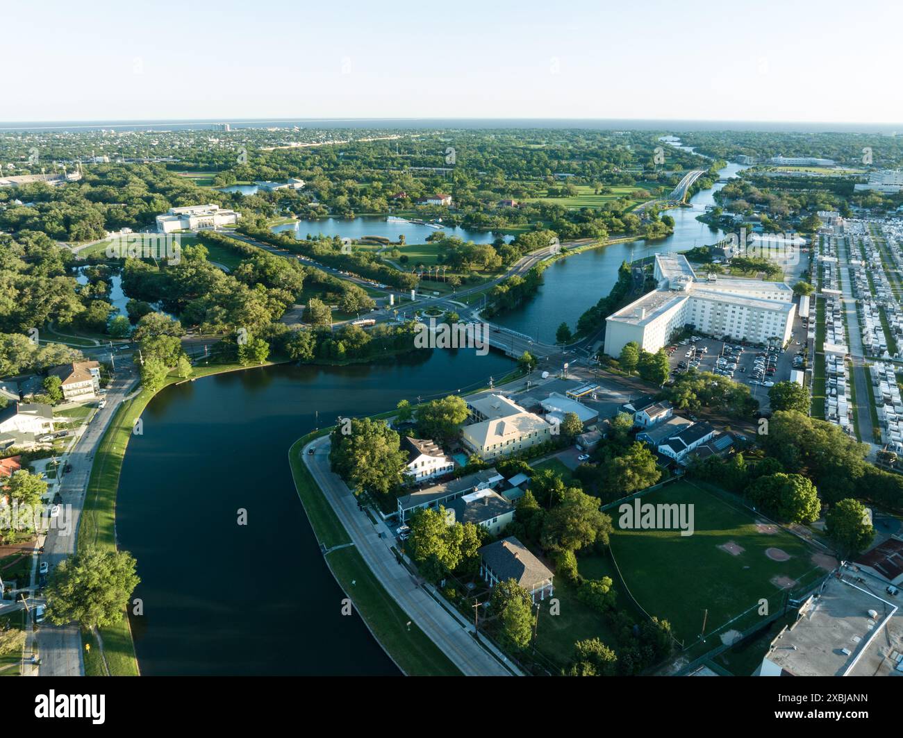 Aerial view of the historic Bayou St. John winding through a lush New ...
