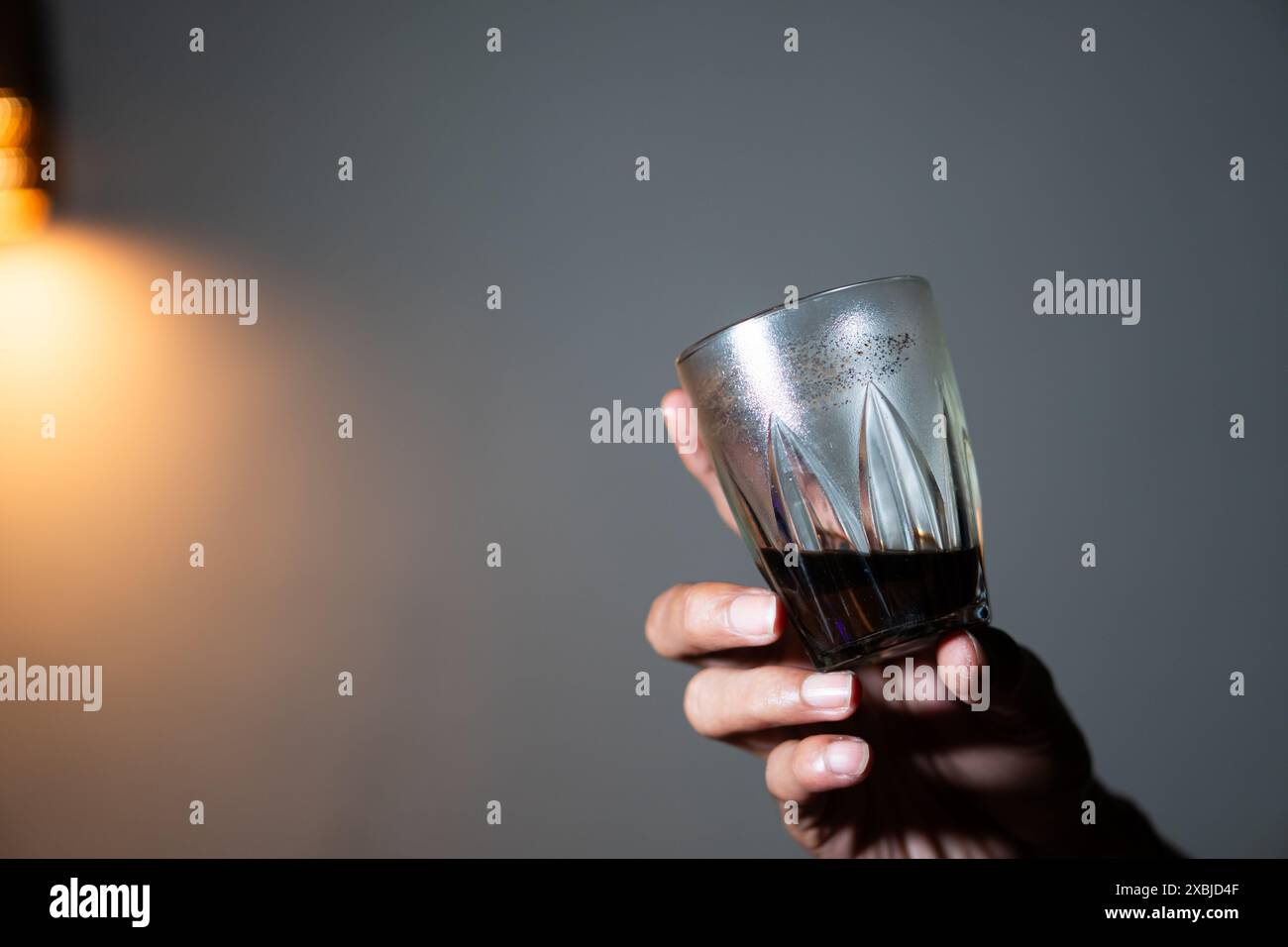 Hand holding full wine glass hi-res stock photography and images - Alamy
