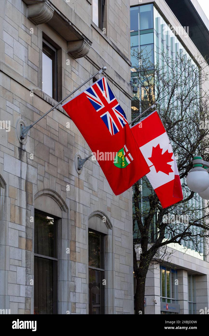 Ottawa, Canada - May 16, 2024: Canadian and Ontario flags on the wall of Lord Elgin hotel ...