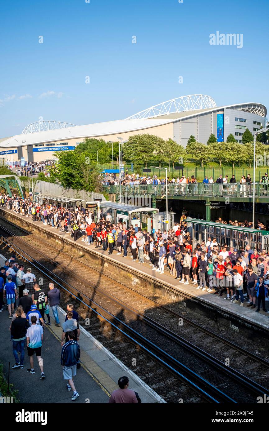 Fans of Brighton and Hove Albion and Manchester United Wait For Trains ...