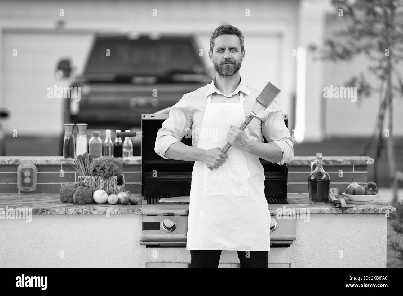 chef man at barbecue and grill outdoor, banner. photo of chef man at ...