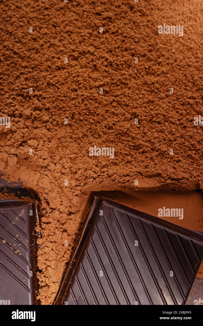 Chocolate pieces on cocoa powder, close-up view Stock Photo - Alamy