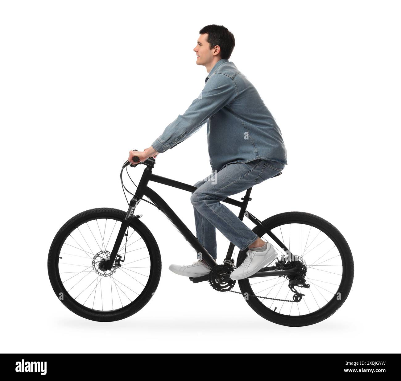 Young man riding bicycle on Cut Out Stock Images & Pictures - Alamy