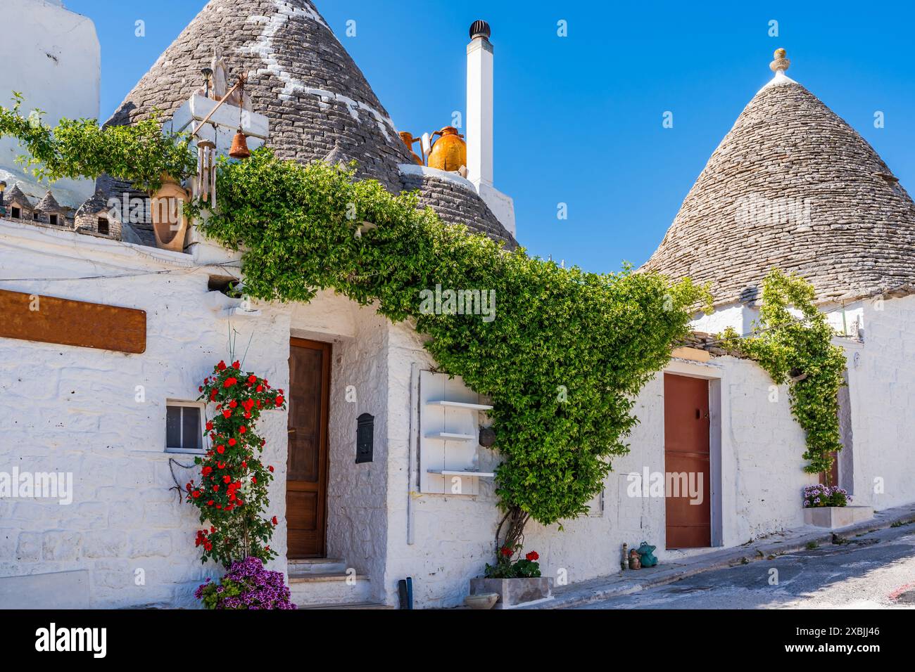 Famous traditional old dry stone trulli houses with conical roofs in ...