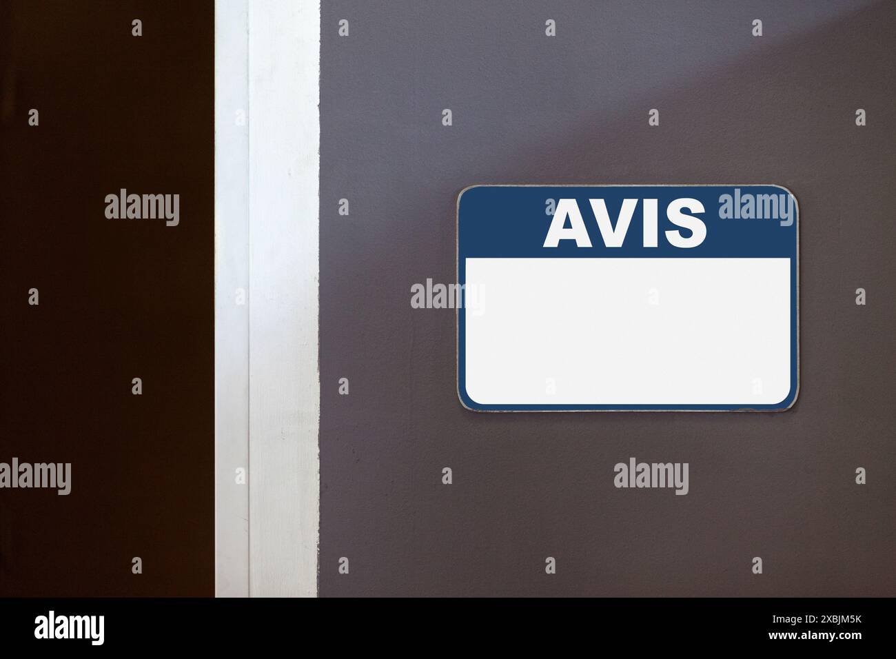Blue and white blank French notice sign on the side of an open door ...