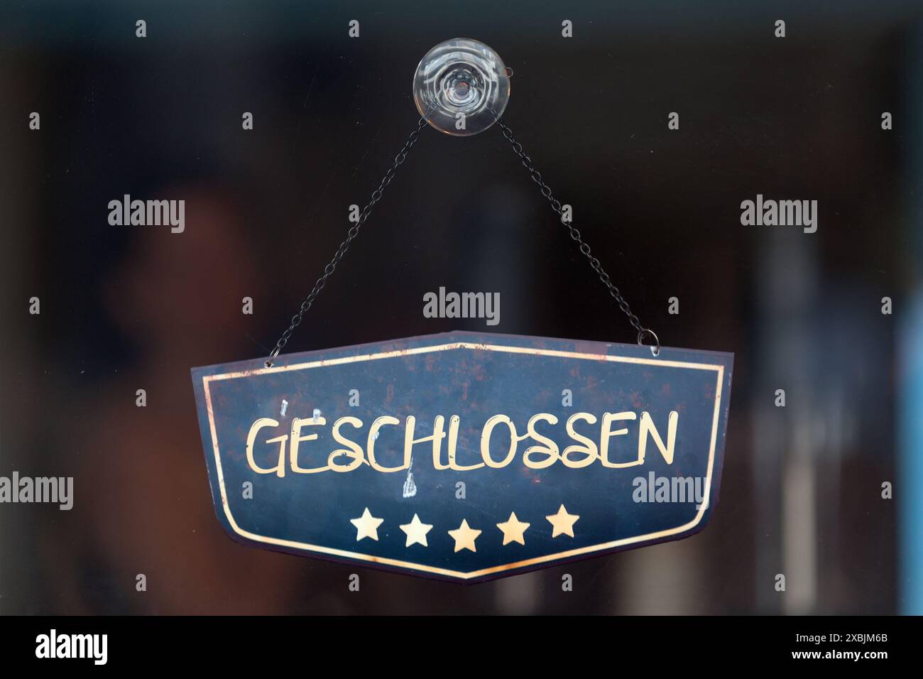 Old fashioned sign in the window of a shop saying in German ...