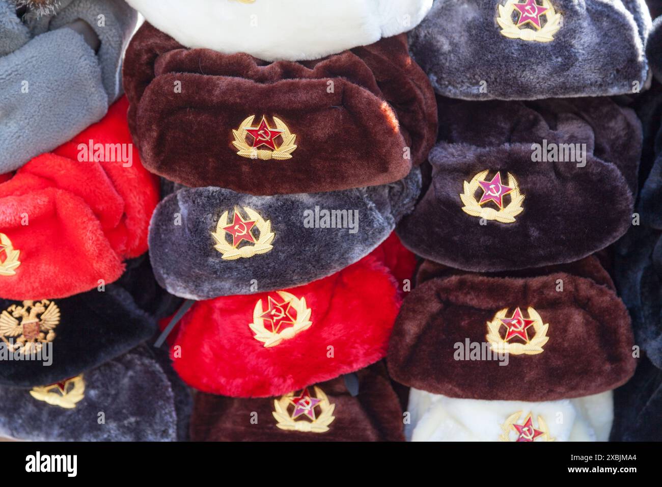 Stack of soviet hats for sale on a market stall near Checkpoint Charlie ...