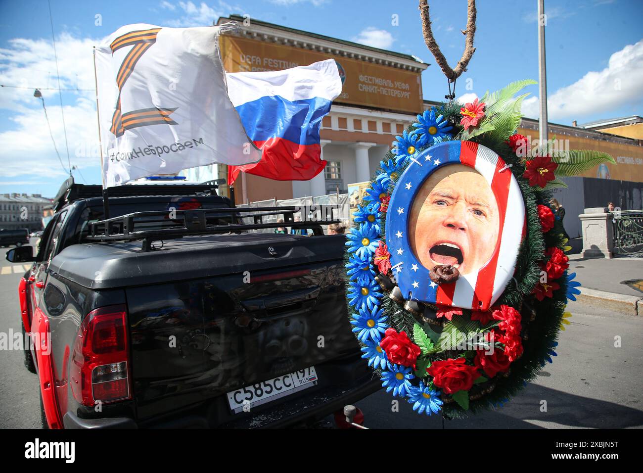 A photo of US President Joe Biden displayed in a toilet rim decorated ...