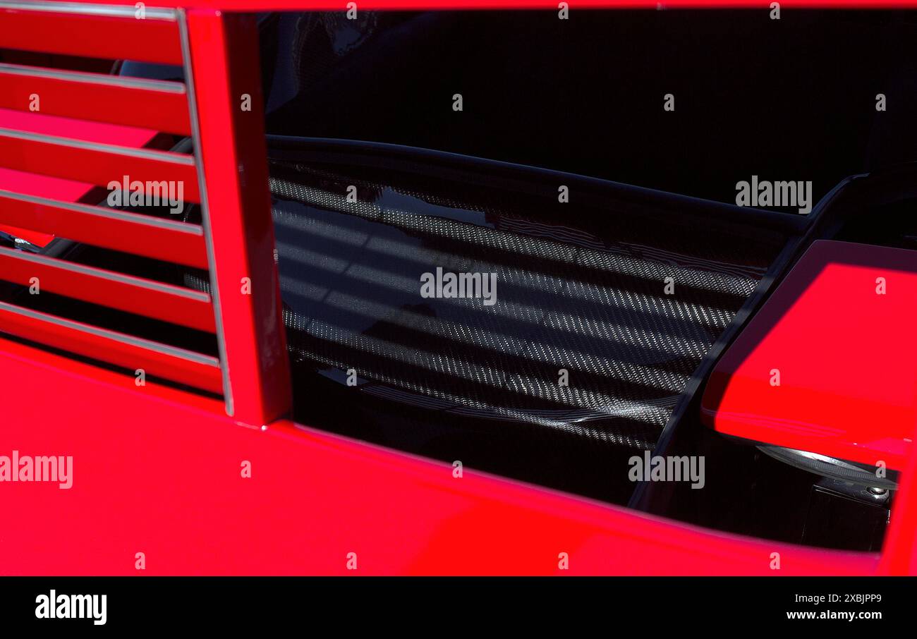 The vents from the front end of a Ferrari BB 512i casts light and ...