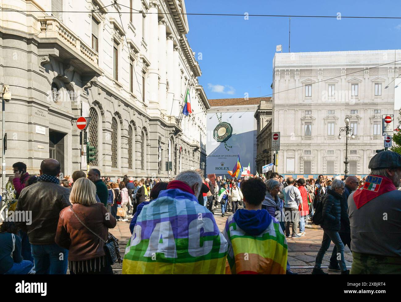 Grandfather and grandson with the flags of peace on their shoulders ...