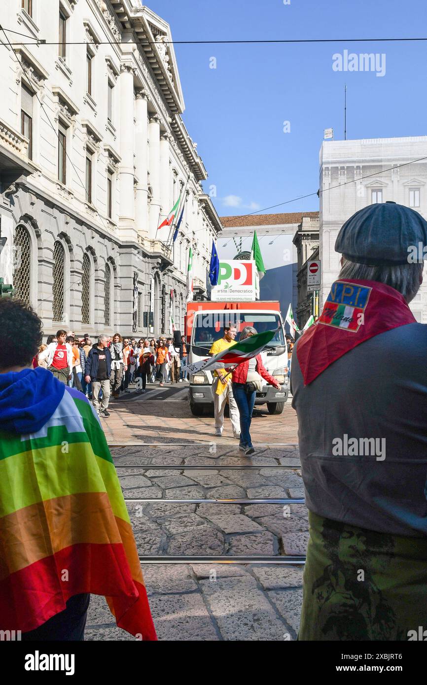 Boy with the peace flag and a senior man with a scarf of ANPI, National ...