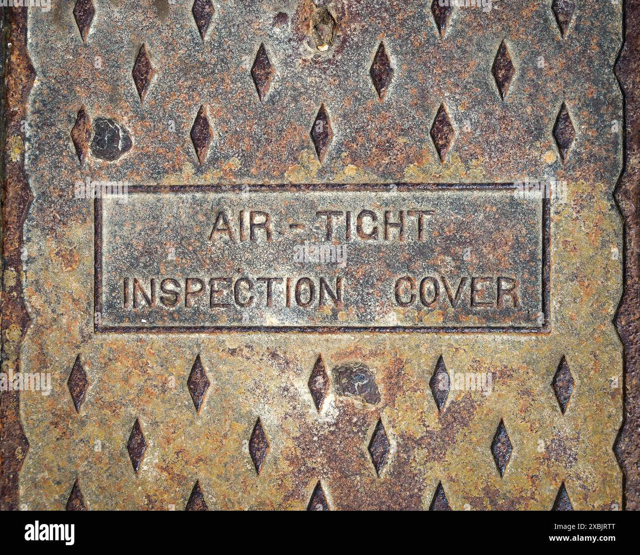 Air-tight inspection cover. Rusty metal Stock Photo - Alamy