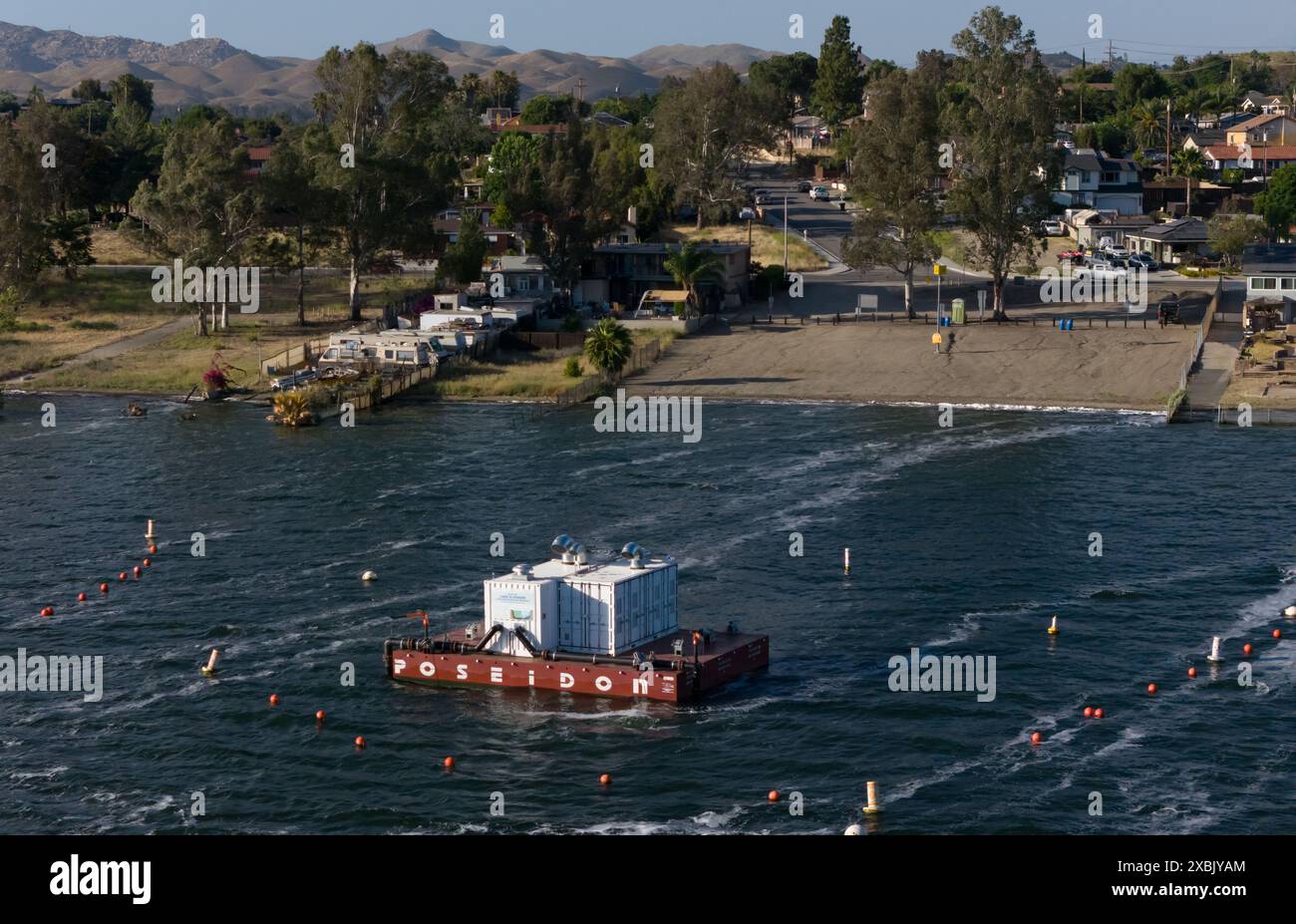 A barge from Moleaer injects nanobubbles into Lake Elsinore, California ...