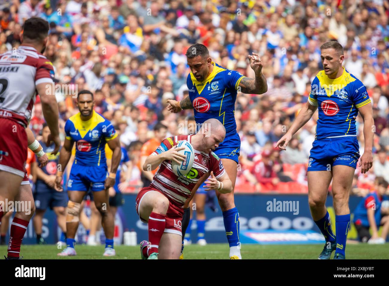 The 2024 Betfred Challenge Cup Final. Paul Vaughan lets Liam Marshall ...