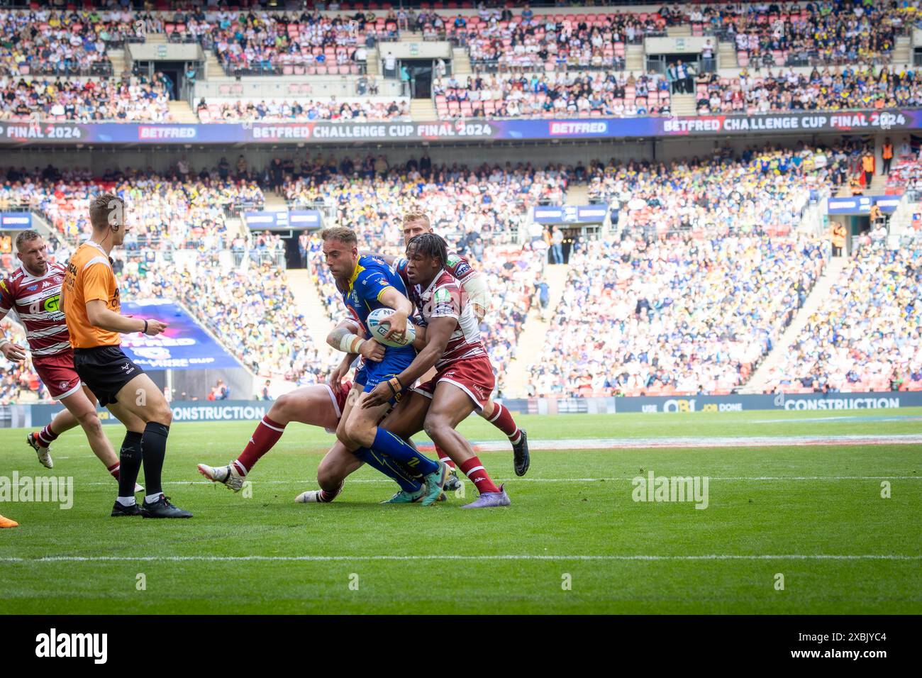 The 2024 Betfred Challenge Cup Final. James Harrison is tackled in ...