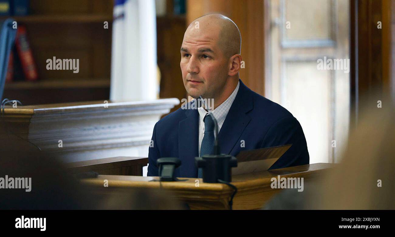Mass State Police Trooper Michael Proctor listens on the witness stand ...