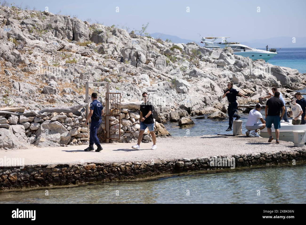 Greek Police Officers guard the body of Michael Mosley at Agia Marina ...