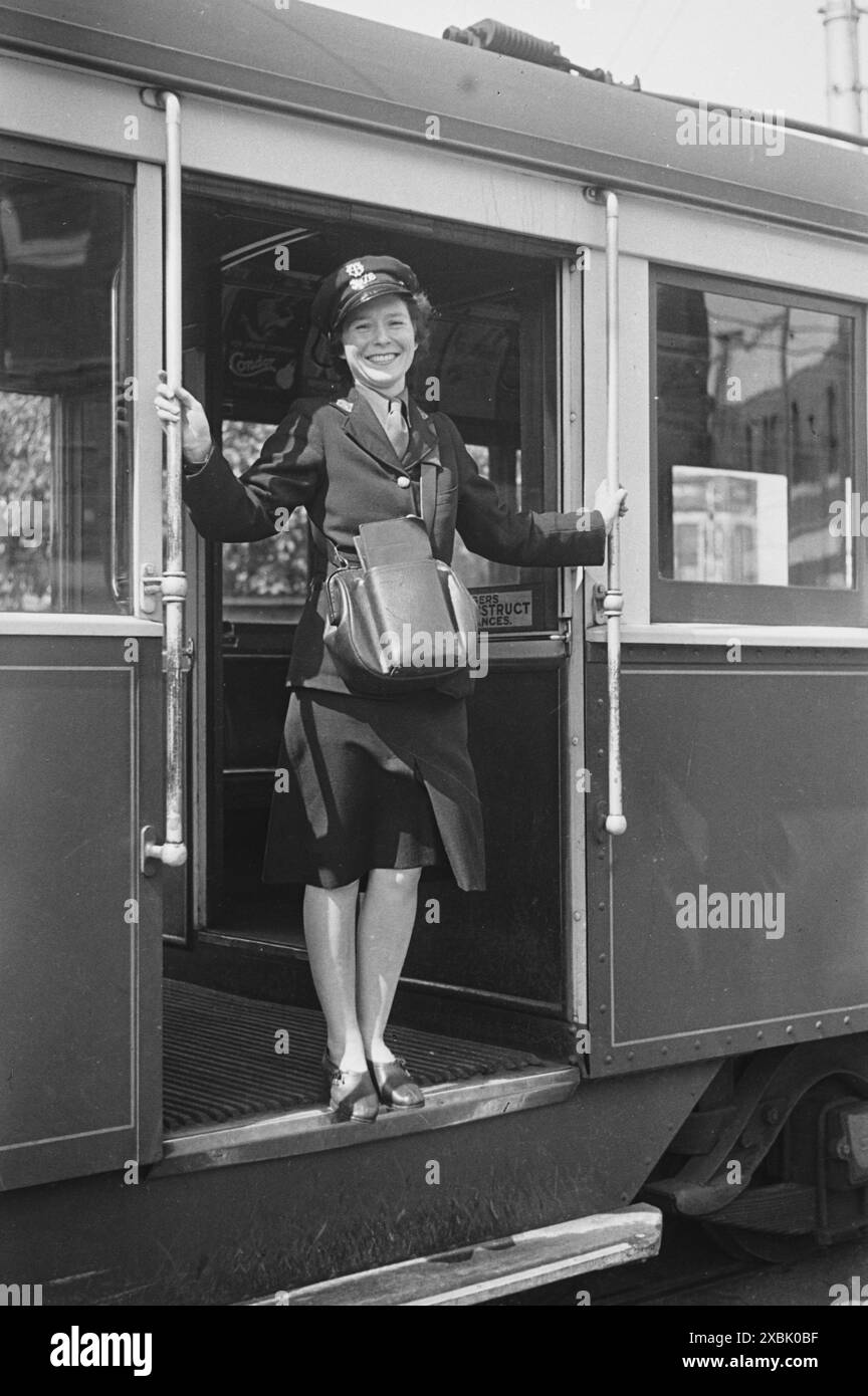 Vintage photo of a woman ticket and fare collector standing in the ...