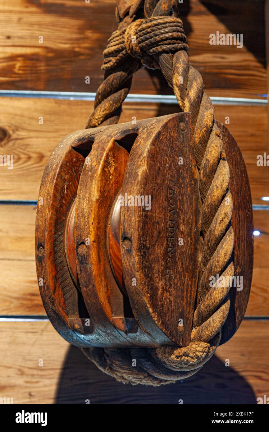 An antique wooden pulley block at the heritage Britannia Shipyard in ...
