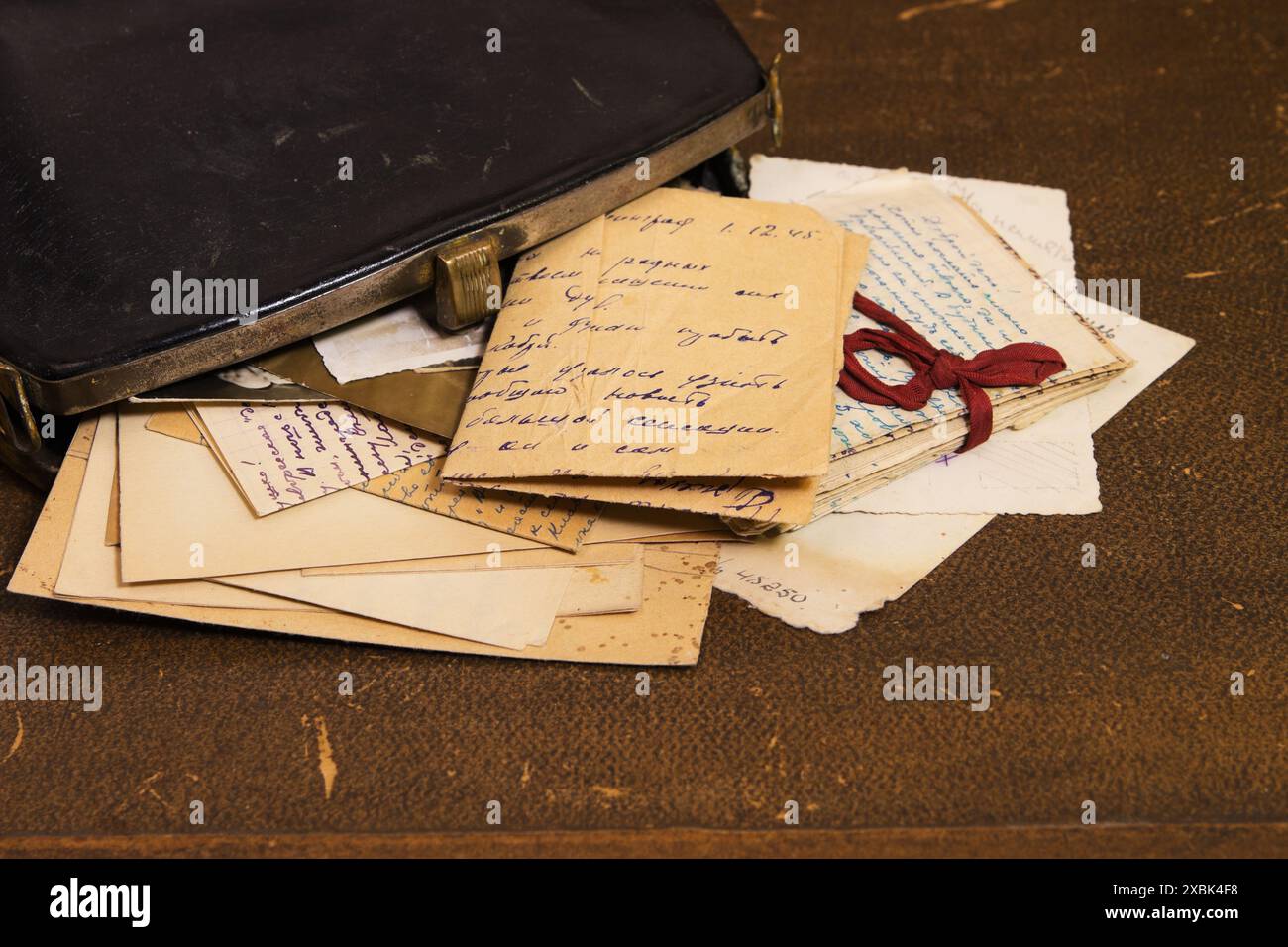 Postal letters in the vintage black handbag Stock Photo - Alamy