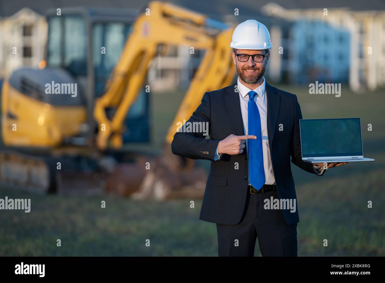 Successful construction business owner. Construction worker in suit and ...