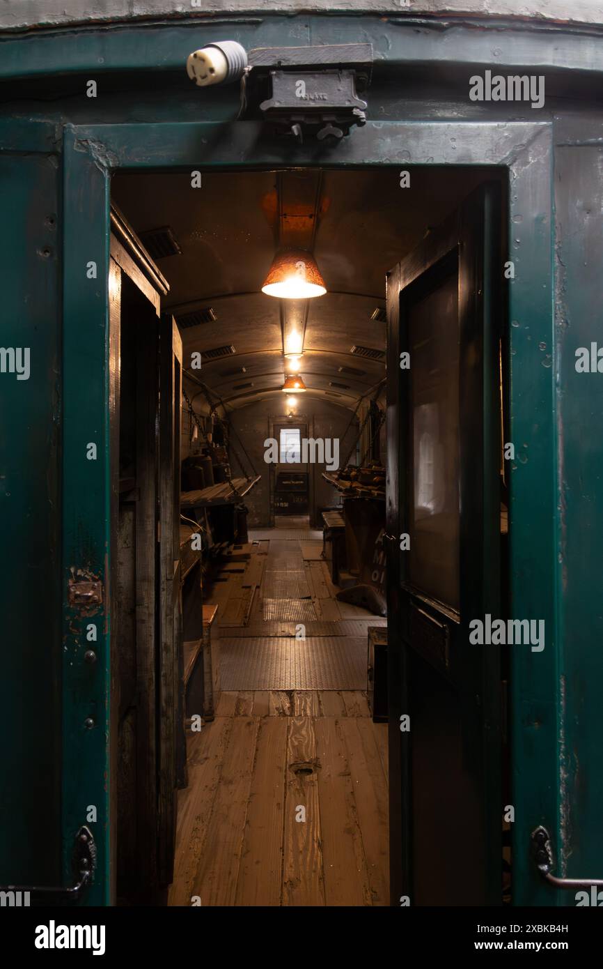 Interior of an old vintage train car with dim lighting and wooden ...