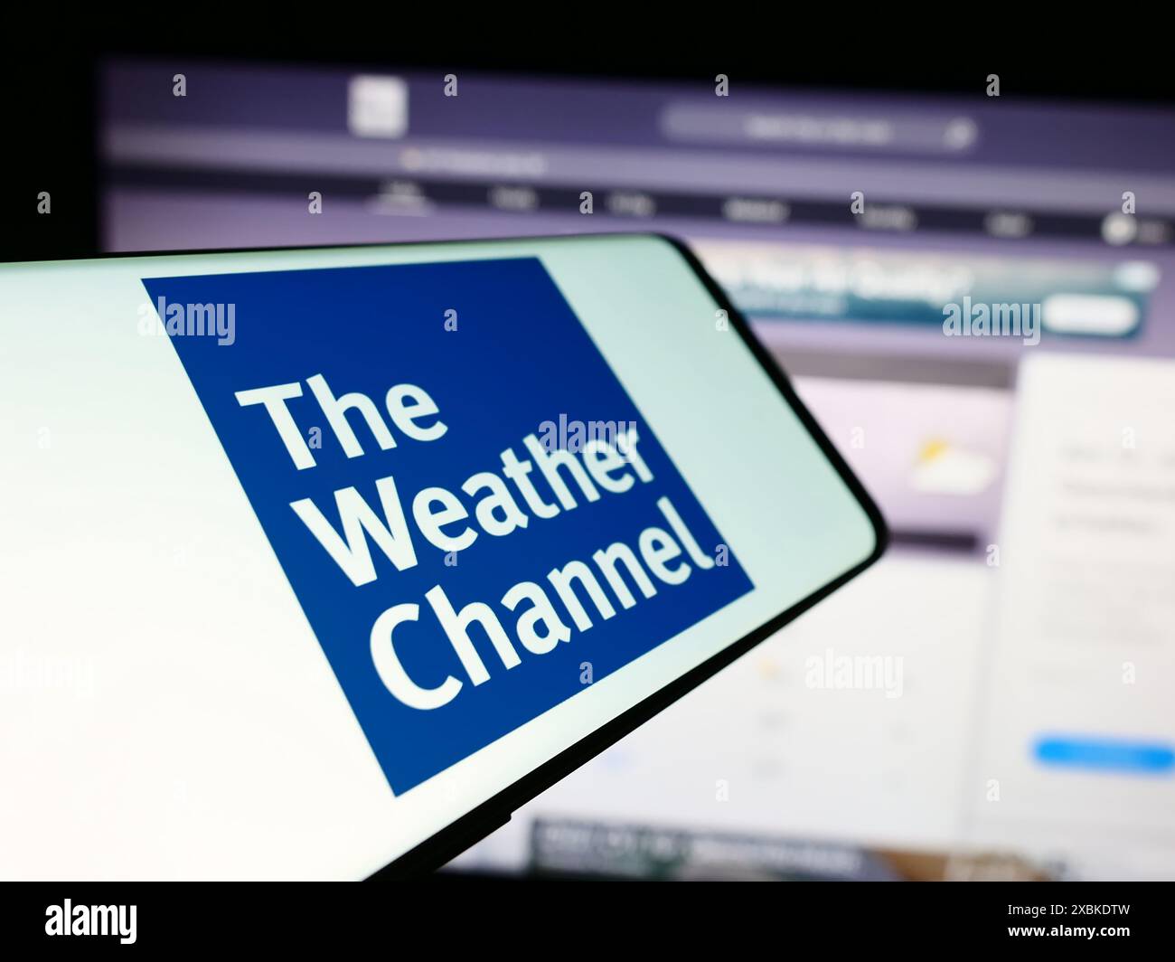 Mobile phone with logo of American pay television channcel The Weather ...