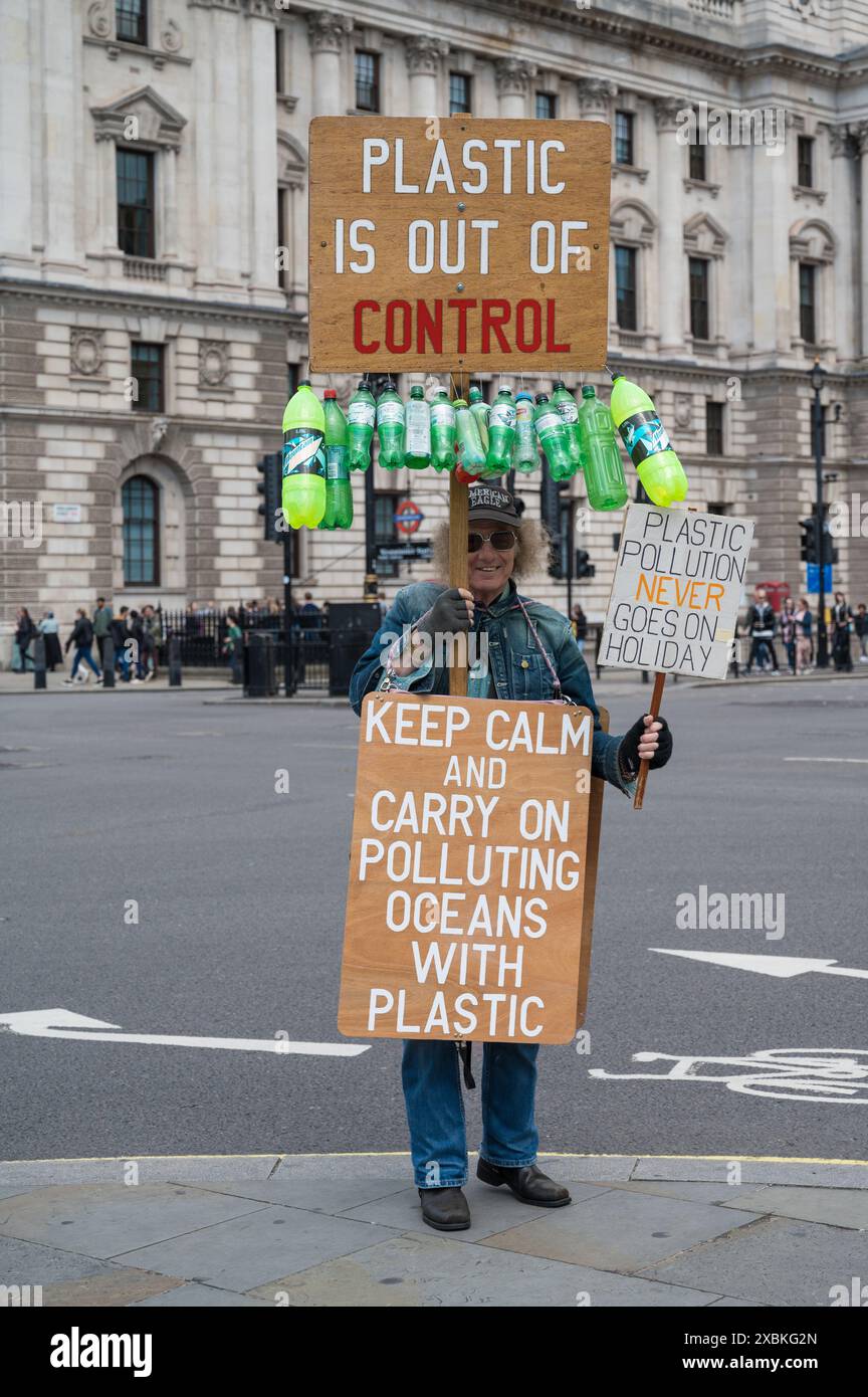 Gentleman wearing sandwich boards and carrying placards protesting ...